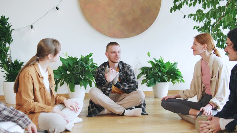 Multiracial Group of Friends Sharing Thoughts while Sitting on the ...