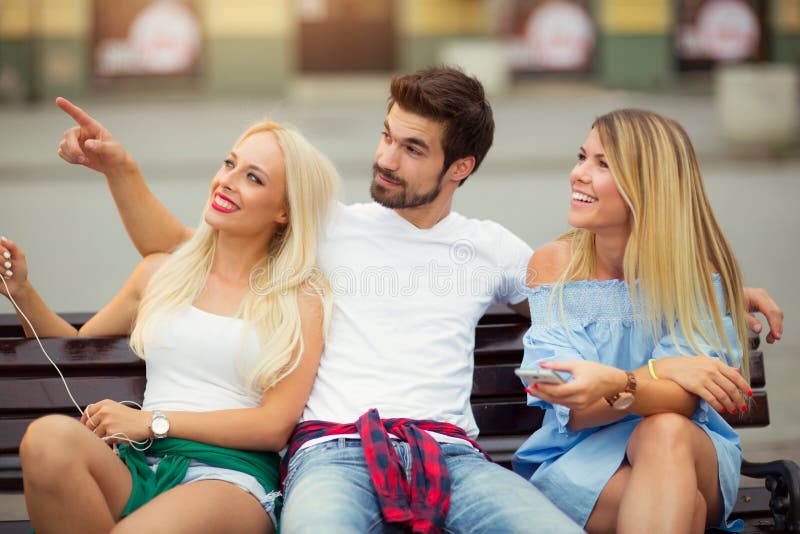 Three Friends Having Fun on the Bench Stock Photo - Image of summer ...