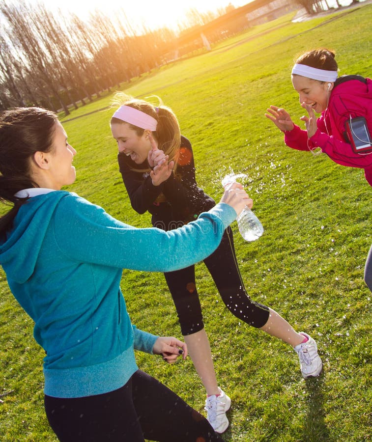 Friends Having Fun with Smartphones after Exercise Stock Photo - Image ...
