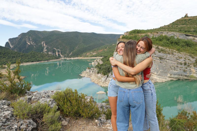 Three Friends Hugging in the Mountain on Vacation Stock Photo - Image ...