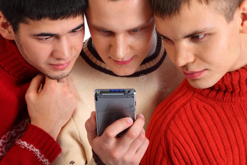 Three Friends Look On Handheld Computer Picture. Image: 9290489