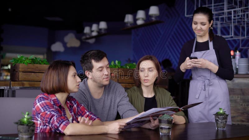 Three Friends Ordering Food in Restaurant Stock Video - Video of modern ...