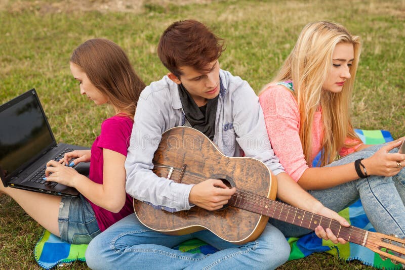Three Friends Relaxing and Having Fun in Park. Stock Photo - Image of ...