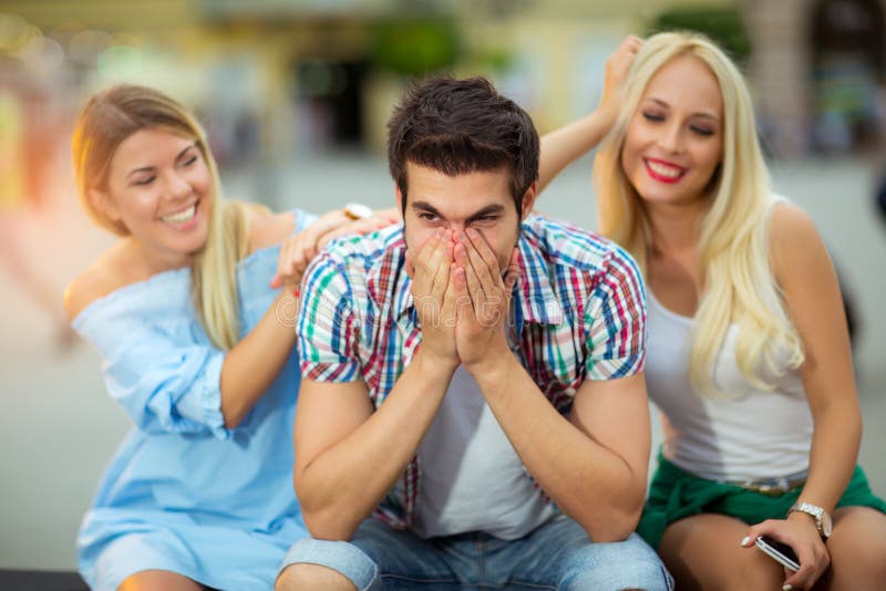 Three Friends Sitting on a Bench and Having Fun Stock Photo - Image of ...