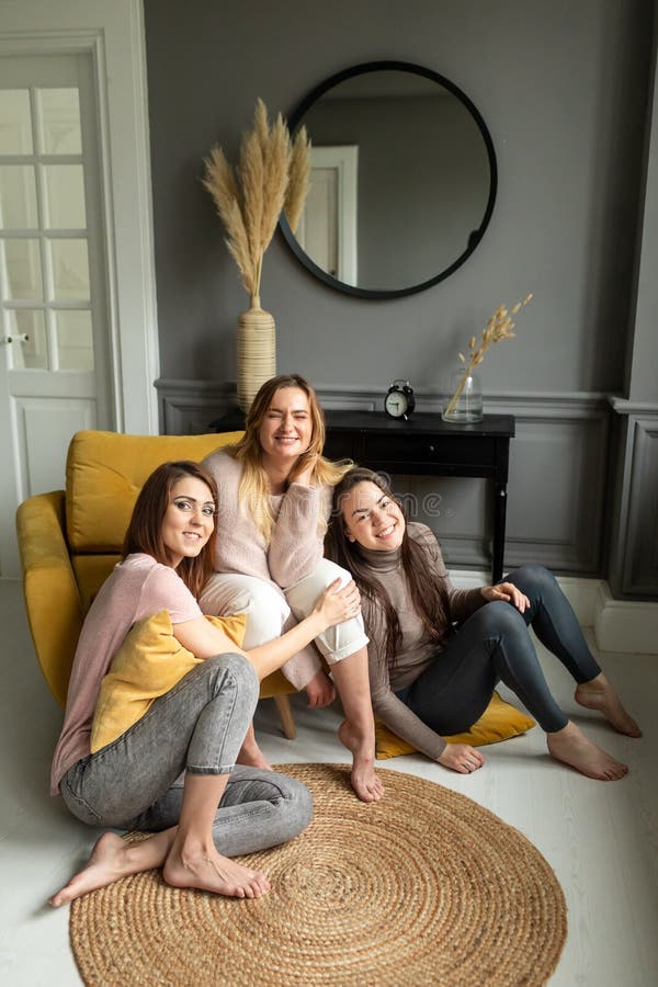 Three Friends are Sitting on the Roof of the House and Chatting Stock ...