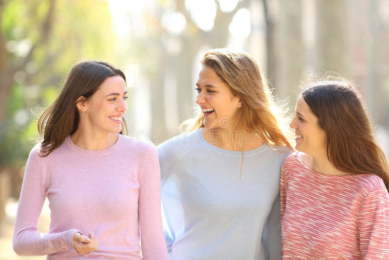 Three Friends Talking Walking in the Street Stock Image - Image of ...