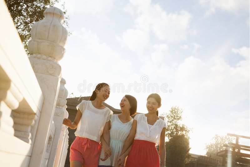 Three Friends Walking Across a Bridge Stock Image - Image of beijing ...
