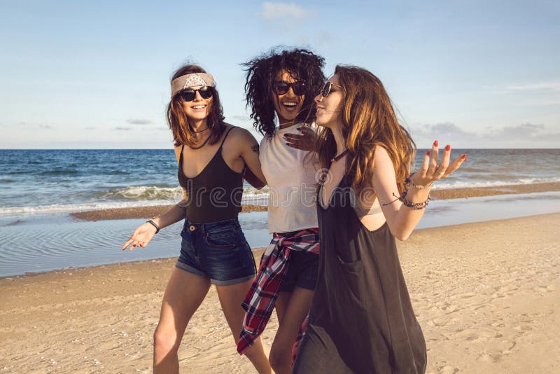 Three Friends Walking on the Beach and Laughing Stock Photo - Image of ...