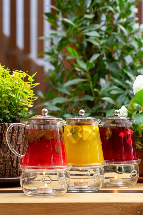 Three Fruit Tea in Teapots on Table Outdoor Stock Image - Image of ...