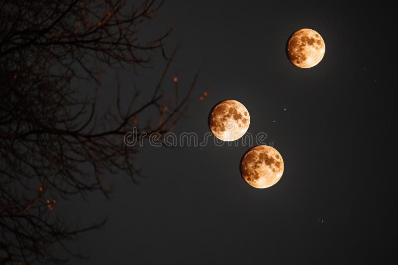 Three Full Moons Shining Brightly in a Starry Night Sky Stock Photo ...