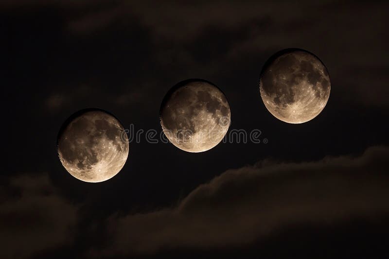 Three Full Moons Shining Brightly in a Starry Night Sky Stock Photo ...
