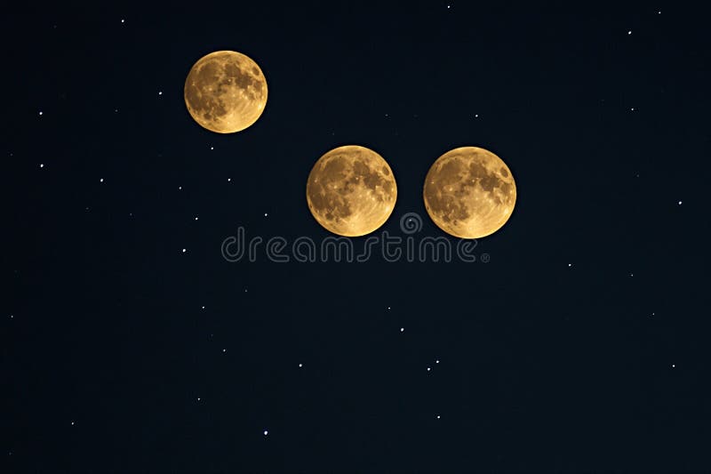 Three Full Moons Shining Brightly in a Starry Night Sky Stock Image ...