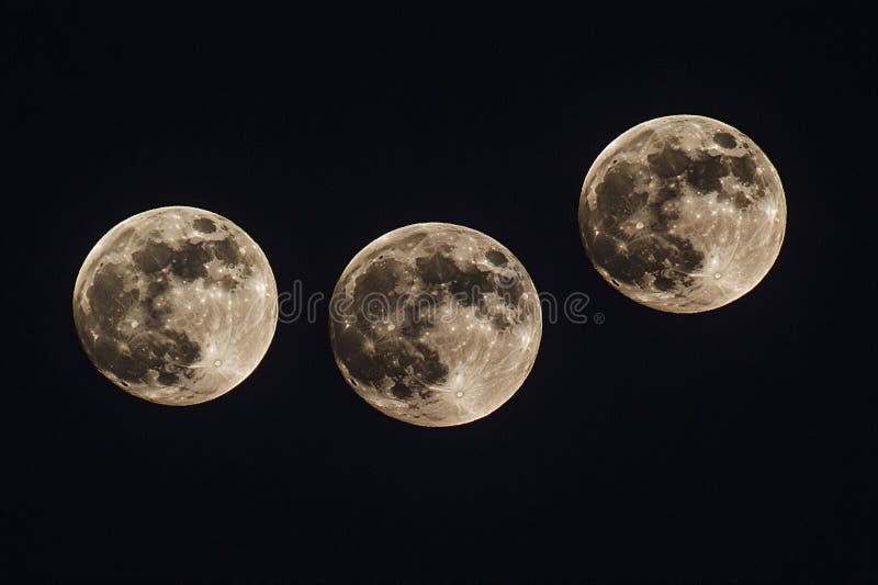 Three Full Moons Shining Brightly in a Starry Night Sky Stock Image ...