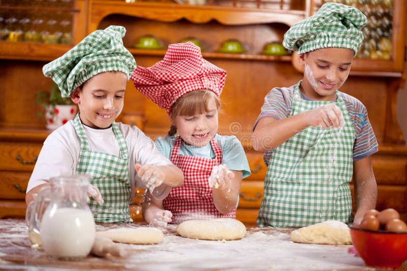 Three Funny Young Child Play with a Dough in the Kitchen Stock Image ...