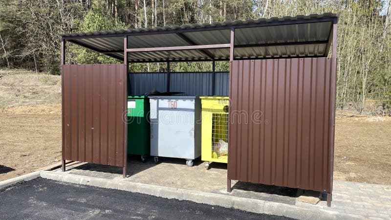 Three Garbage Bins for Separate Waste Disposal are Located in a Closed ...