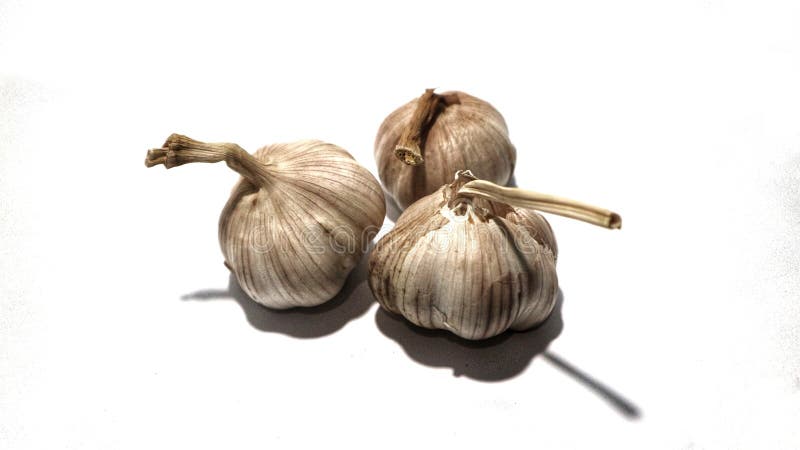 Three Garlic on White Background Stock Photo - Image of eatable ...