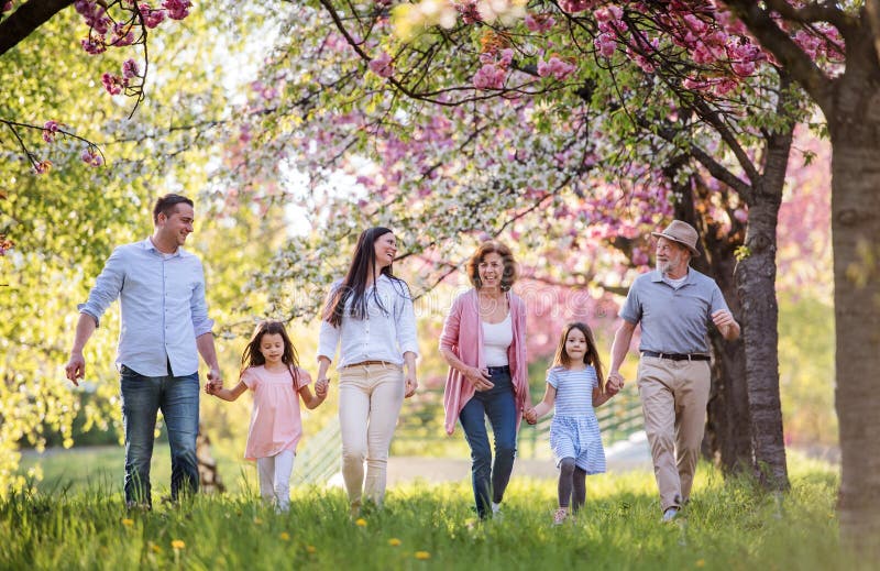 Three Generation Family Walking Outside in Spring Nature. Stock Image ...