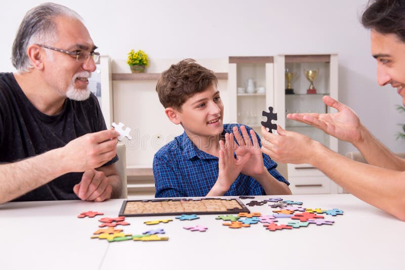 Three Generations of Family Playing Jigsaw Puzzle Game Stock Image ...