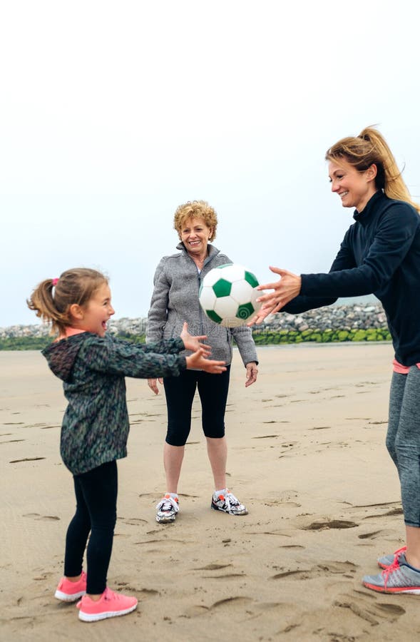 Three Generations Female Playing on the Beach Stock Image - Image of ...