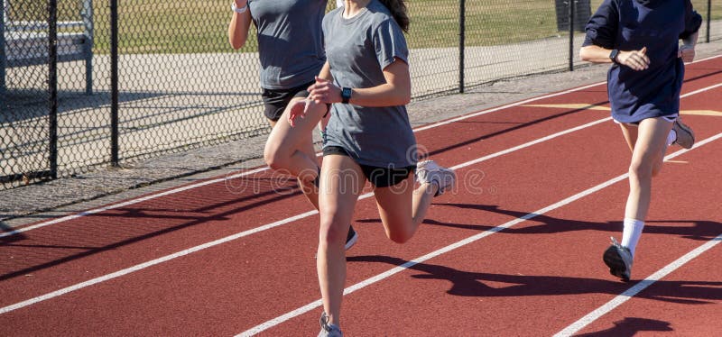 Three Giels Running Fast on a Track Stock Image - Image of sprinters ...