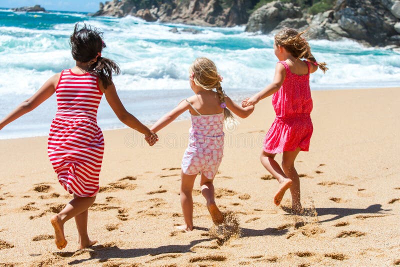 Three Girlfriends Having Fun on Beach. Stock Image - Image of blue ...