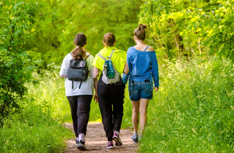 Three Girlfriends Walk Along a Path I Editorial Photo - Image of young ...
