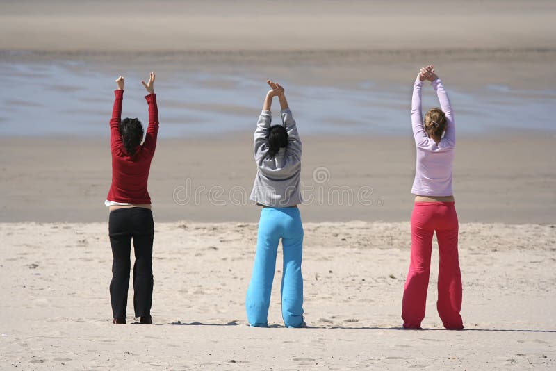 Three girls in the beach stock photo. Image of dancer - 2360196