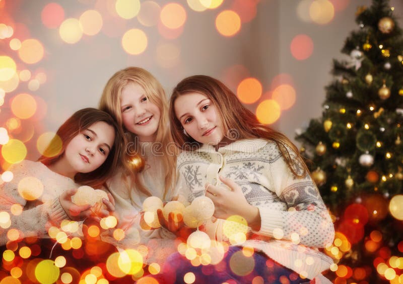 Three Girls at Christmas Tree Stock Image - Image of firtree, christmas ...