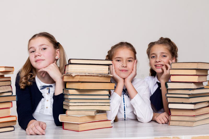 Three Girls in the Classroom Studying Many Books Stock Image - Image of ...