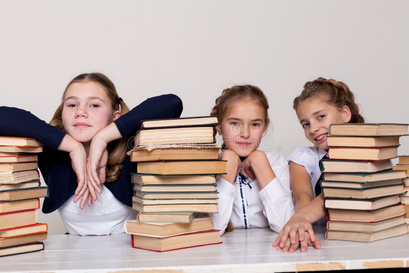 Three Girls in the Classroom Studying Many Books Stock Image - Image of ...