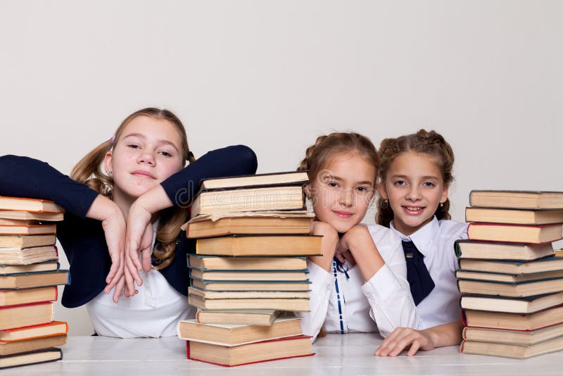 Three Girls in the Classroom Studying Many Books Stock Image - Image of ...