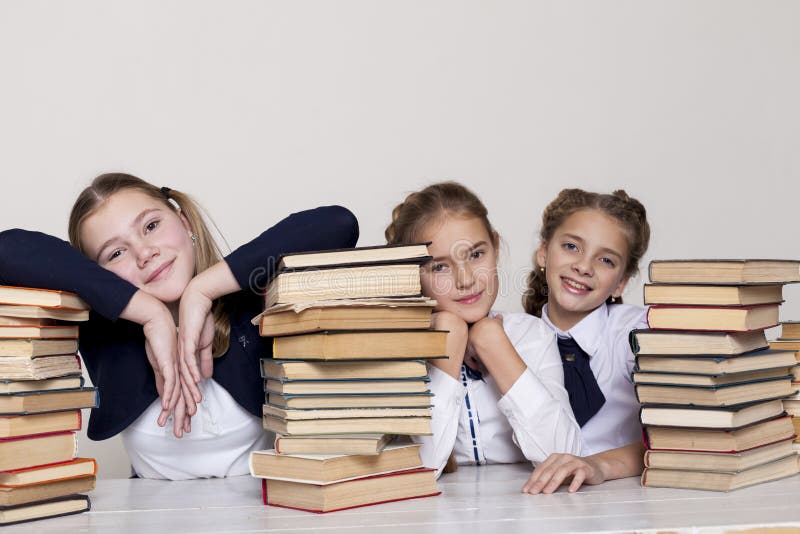 Three Girls in the Classroom Studying Many Books Stock Image - Image of ...
