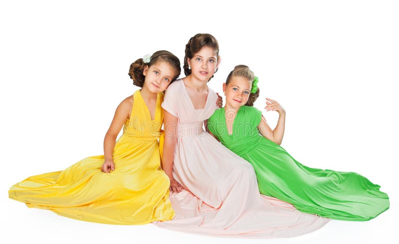 Three Girls in Colorful Dresses Stock Photo - Image of yellow, positive ...