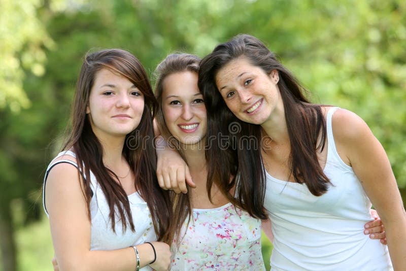 Three girls stock photo. Image of park, discussing, teens - 48968814