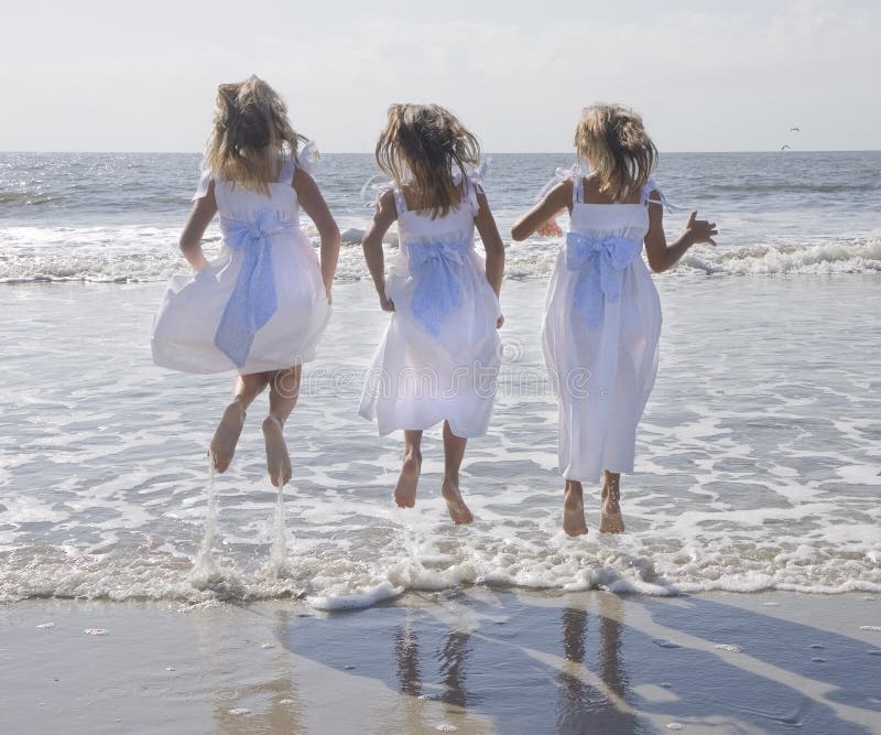 Three Sisters Holding Hands Stock Photo - Image of ocean, barefoot: 2504288