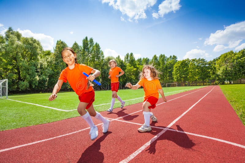 Three Girls with One Relay Baton Running Stock Photo - Image of ...