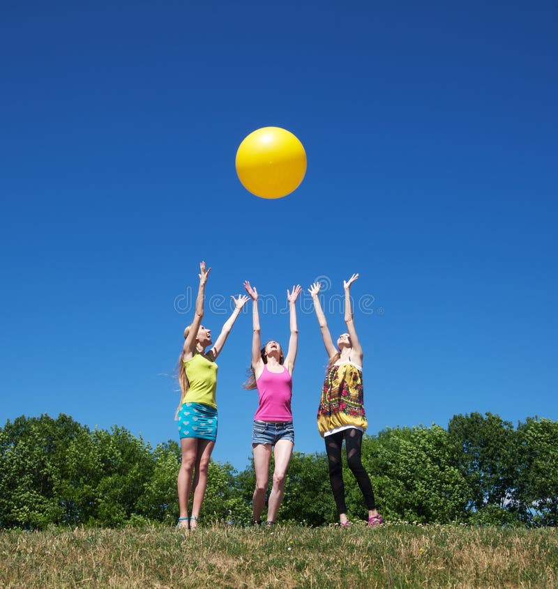 Three Girls Play with Yellow Ball Stock Image - Image of ball, healthy ...