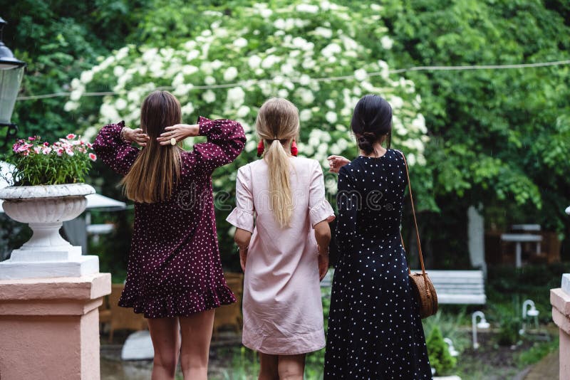 Three Girls Posing on Camera Stock Photo - Image of vacation, dress ...