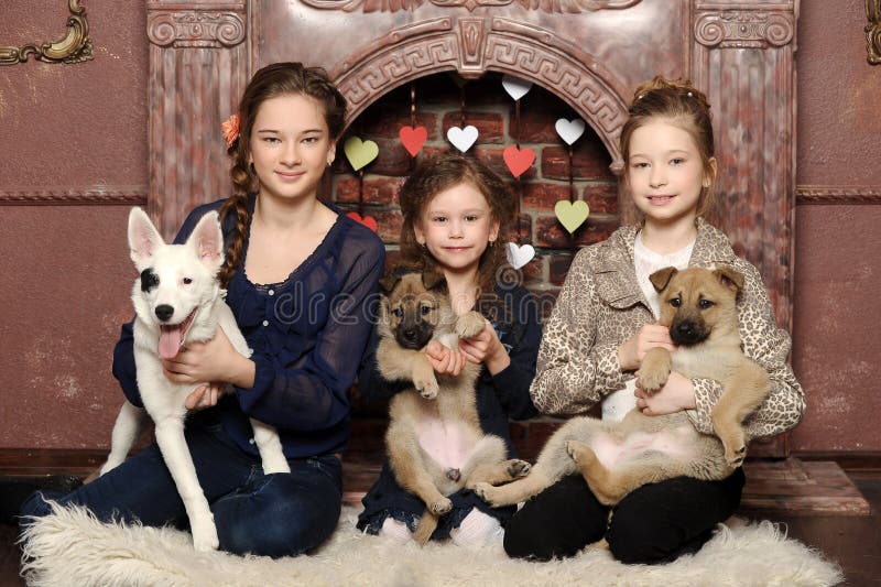 Three girls with puppies stock photo. Image of dogs, breeders - 31694124