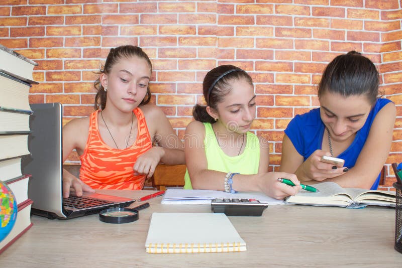 Three Girls Work on His Homework. Portrait of Three Girls School ...