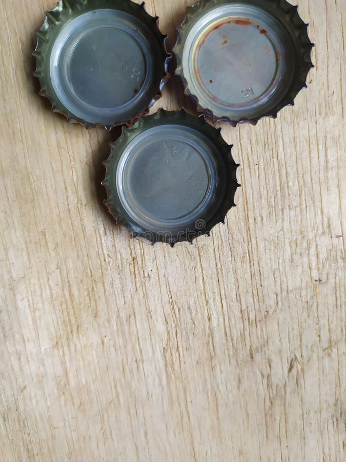 Three Glass Bottle Caps Arranged in a Triangle Stock Image - Image of ...