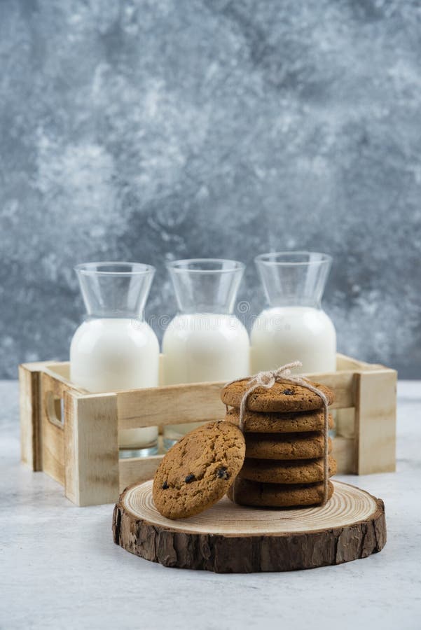 A Stack of Cookies Tied with a Jute Rope. Next To it is a Glass of Milk ...