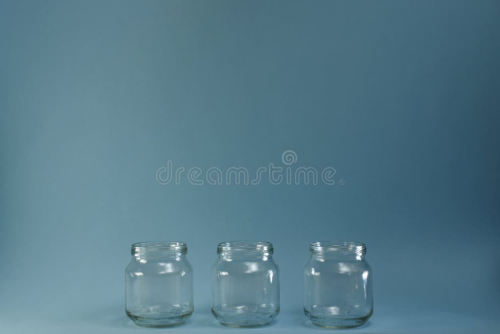 Three Glass Jars at the Bottom of the Center Horizontal Row. Stock ...