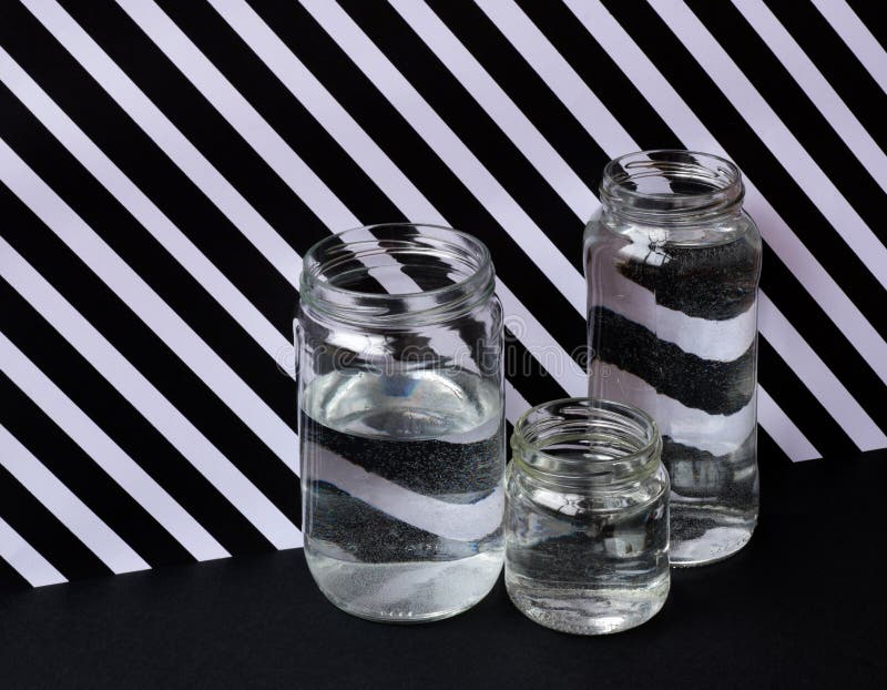 Three Glass Jars Placed Together of Heterogeneous Sizes with Water ...