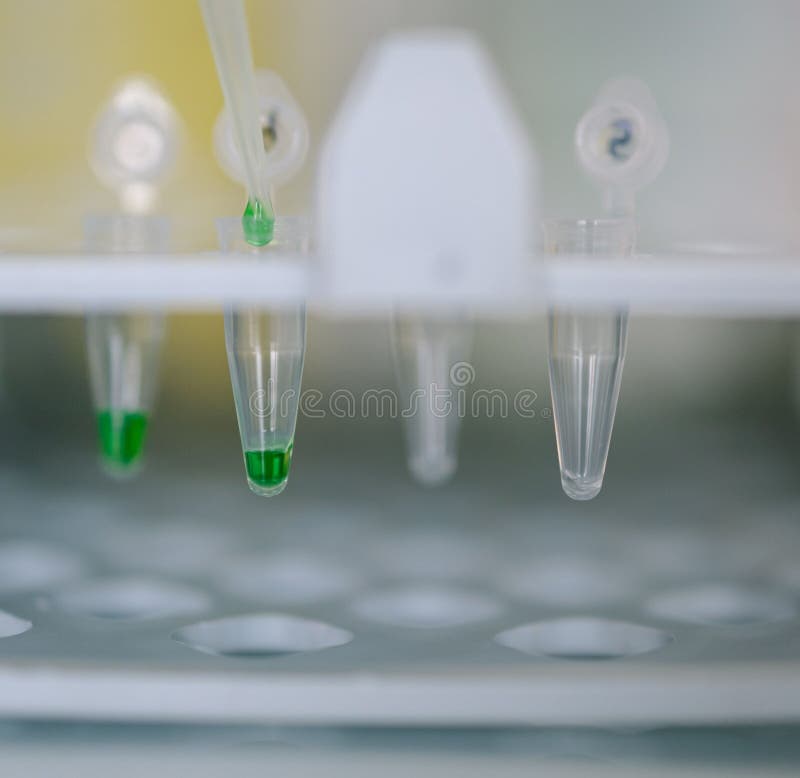 Glass Vials Containing Green Liquid, with One Vial at the Forefront ...