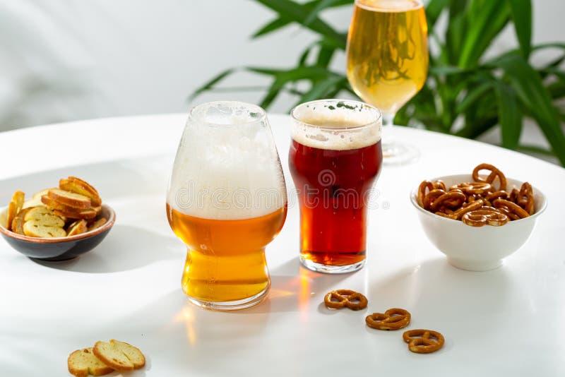 Three Glasses with Beer Light Craft Dark and Snacks Stock Photo - Image ...
