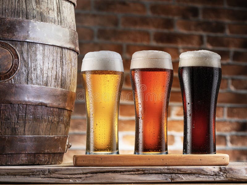 Three Glasses of Different Types of Chilled Beer and Wooden Beer Cask ...