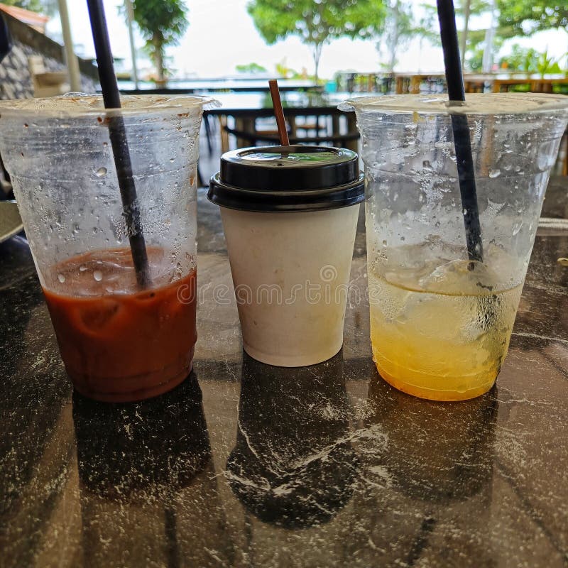 Three Glasses of Drinks with Chocolate, Orange and Hot Coffee Flavors ...