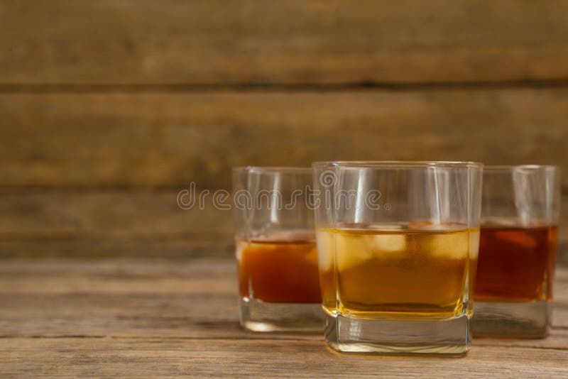 Three Glasses of Whiskey with Ice Cube Stock Image - Image of care ... Three Glasses of Whiskey with Ice Cube Stock Image - Image of care ...