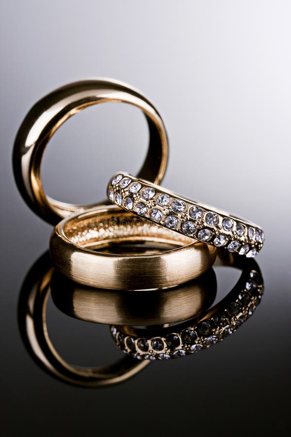 Three gold rings. stock photo. Image of metal, dark, design - 14800168
